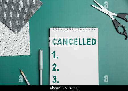 Hand writing sign Cancelled, Word Written on decide or announce that ...