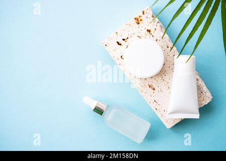 Natural cosmetic product with palm leaves on blue background Stock ...