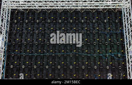Backside of big LED screen monitor display. Texture of back view of LED panels. Power input and ...