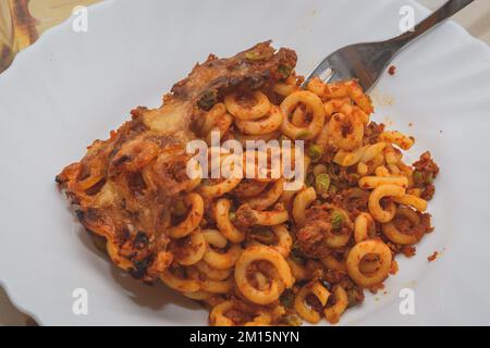 Baked Anelletti Pasta With Ragu Sauce Stock Photo - Alamy