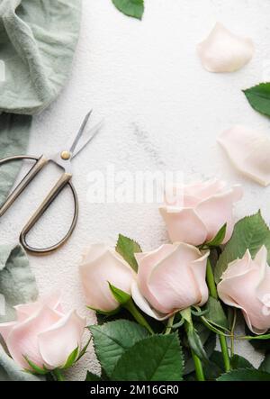 Florist workplace: Roses and florist accessories. Decor making Stock ...