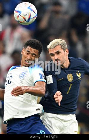England's Jude Bellingham and France's Antoine Griezmann (right) battle for the ball during the ...