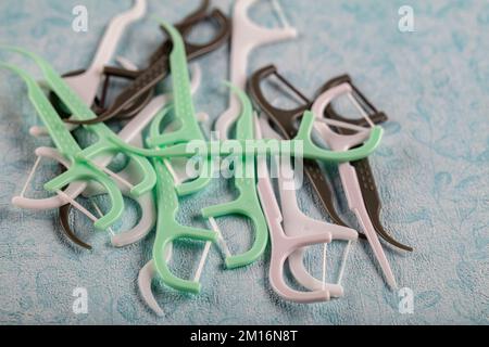 Colorful toothpick. Assorted colors dental floss pick on the color ...