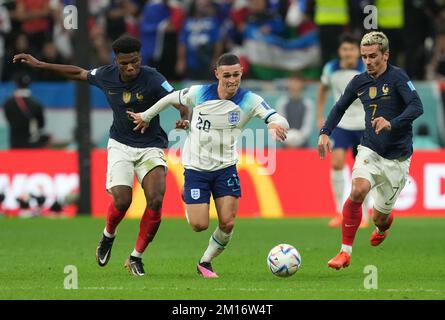 England's Phil Foden (centre) battles for the ball with Albania's Ylber ...
