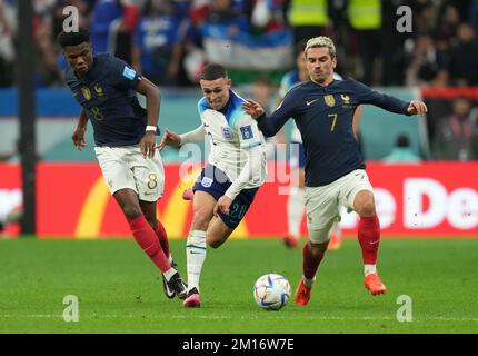 England's Phil Foden (centre) battles for the ball with Albania's Ylber ...