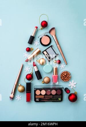 Makeup products and Christmas decorations on color background. Top view ...