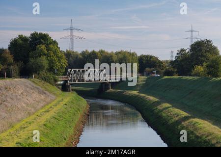 Water channel with power lines, bypass channel for big river. Sunny day ...