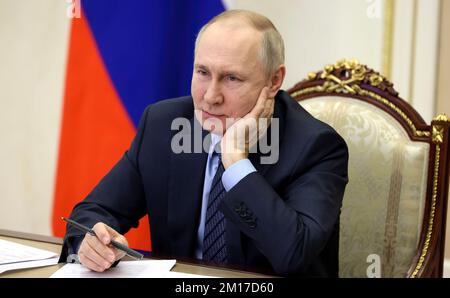 Russian President Vladimir Putin conducts a teleconference from his ...