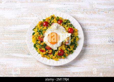 Chinese fried rice with turmeric, chickpeas, tomatoes, kale and with ...