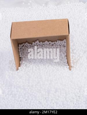 Box on little white polystyrene foam balls Stock Photo - Alamy