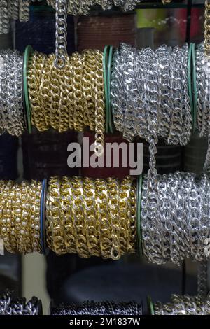 Rolls of decorative chains in view Stock Photo - Alamy