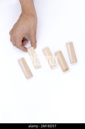 Hand pulling out wooden blocks with Inspire Positive Change text Stock ...
