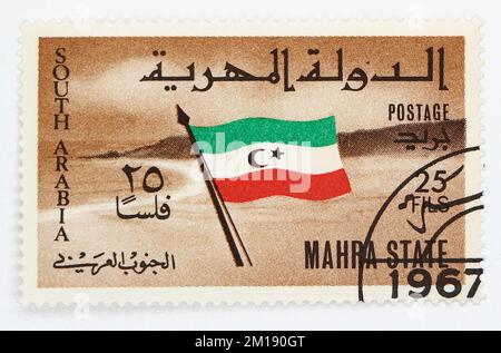 Photo of a postage stamp from the Mahra State of Qishn and Socotra Flag ...