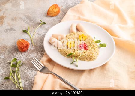 Funny mixed quinoa porridge, sweet corn, pomegranate seeds and small ...