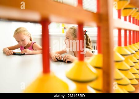 Children with learning difficulty in occupational therapy. Girls doing ...