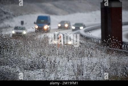 Rostock, Germany. 11th Dec, 2022. Passenger cars driving on the snow ...
