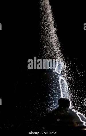 Sugar spill flow low light Stock Photo - Alamy