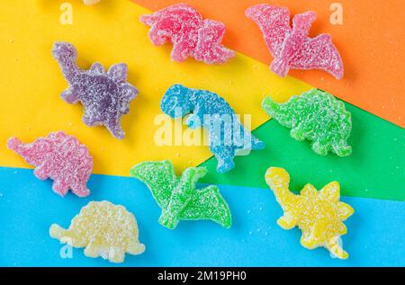 Dinosaurs colorful jelly bonn, candies on the color background Stock ...