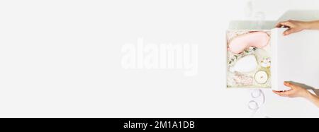 Female hands hold sleep mask on pink background Stock Photo - Alamy