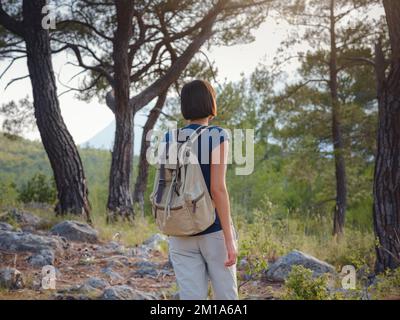 woman traveler walking by Lycian Way trail mountains in Turkey near ...