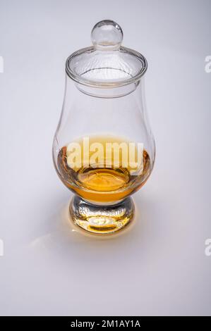Tulip-shaped tasting glass with dram of Scotch single malt or blended ...