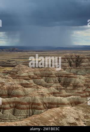 Rain storm over the badlands and plains from the Burns Basin Overlook ...