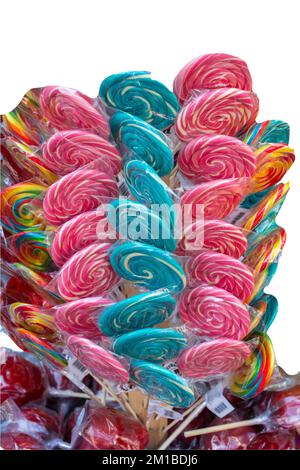 Colorful spiral lollipop of different colors round candies. Colorful ...