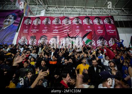 Fans react as they watch a live broadcast of the Africa Cup of Nations ...