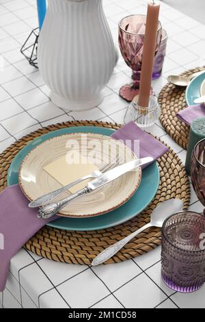 Beautiful table setting with candles and blank card, closeup Stock ...