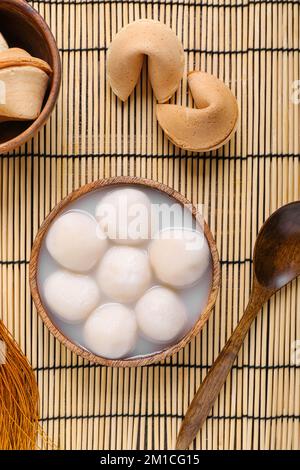 Fortune cookies on a bamboo mat with chopsticks and a fortune Stock ...