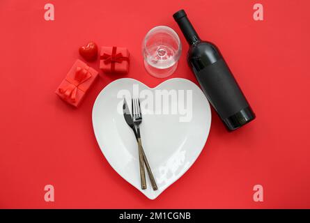 Table setting for Valentine's Day with gifts on black wooden background ...