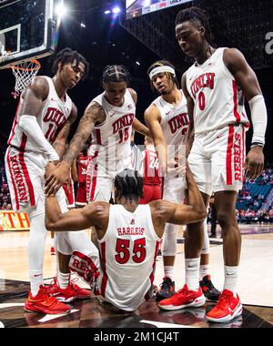 UNLV guard Luis Rodriguez (15), Wyoming guard Sam Griffin (3) and ...