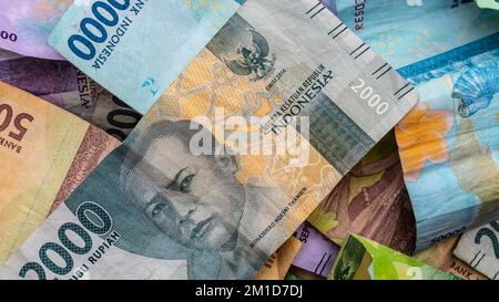 pile of rupiah banknotes as background Stock Photo - Alamy