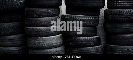 Stack of wheels black tyres outoors Stock Photo - Alamy