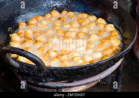 Pan with frying sweets Stock Photo - Alamy