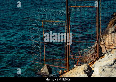 Barbed wire fence used for protection purposes Stock Photo - Alamy