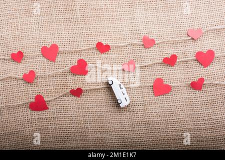 Love concept with car and paper heart on linen threads Stock Photo - Alamy