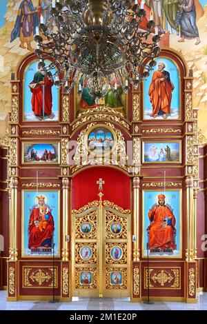 The iconostasis decorated with icons and religious paintings inside the church of the Greek ...