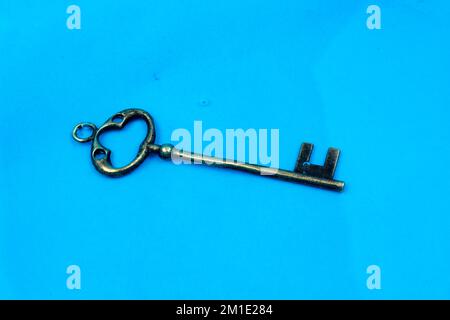 Retro styled key in water in blue background Stock Photo - Alamy