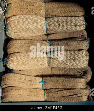 Bundle of linen rope in a market place Stock Photo - Alamy