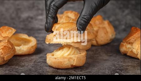 Custard-filled profiteroles ready to serve. The profiteroles are filled ...