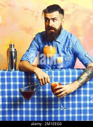 Brutal caucasian hipster with alcoholic cocktails and bar stuff Stock ...