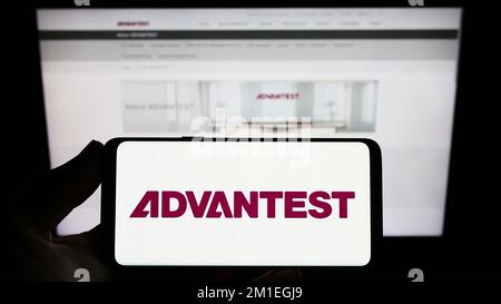 Advantest company logo on a website with blurry stock market ...