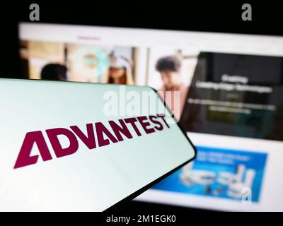 Advantest company logo on a website with blurry stock market ...