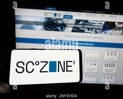 Mobile phone with webpage of Egyptian Suez Canal Economic Zone (SCZONE ...
