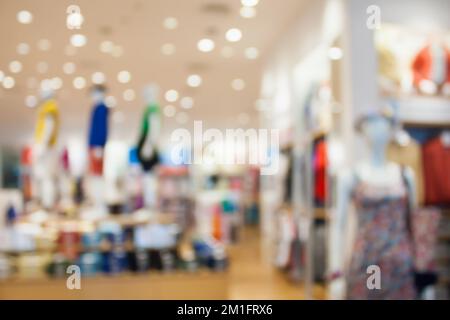 clothing boutique store interior blurred background Stock Photo - Alamy