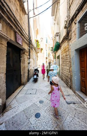 Family of tourists waking in streets Bari, Puglia, South Italy Stock ...