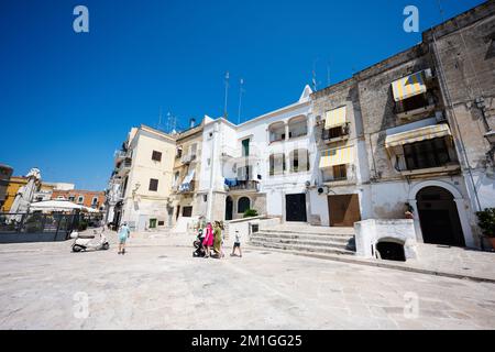 Family of tourists waking in streets Bari, Puglia, South Italy Stock ...