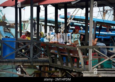 Indigenous Rungus people working in the fishing industry in Kudat ...