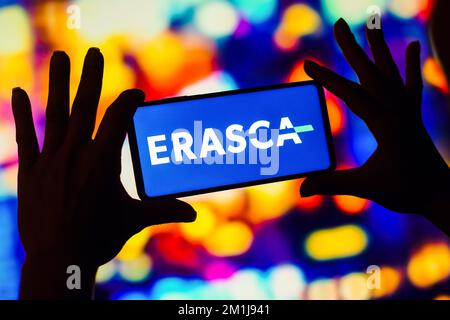 In this photo illustration, the Erasca logo is displayed on a ...